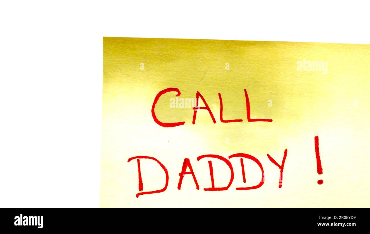 Call daddy handwriting text close up isolated on yellow paper with copy ...