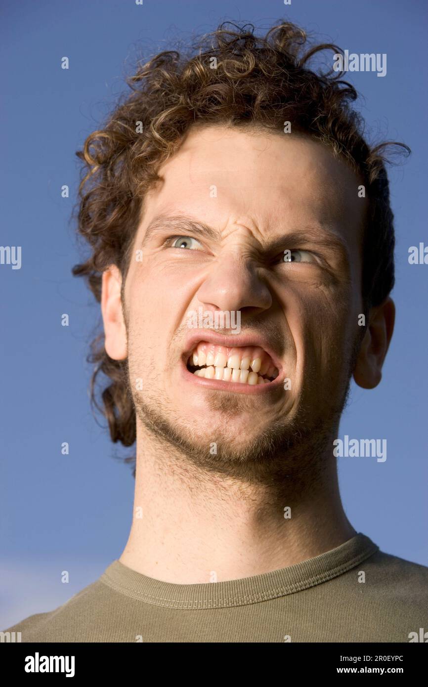 Portrait of angry young man Stock Photo - Alamy