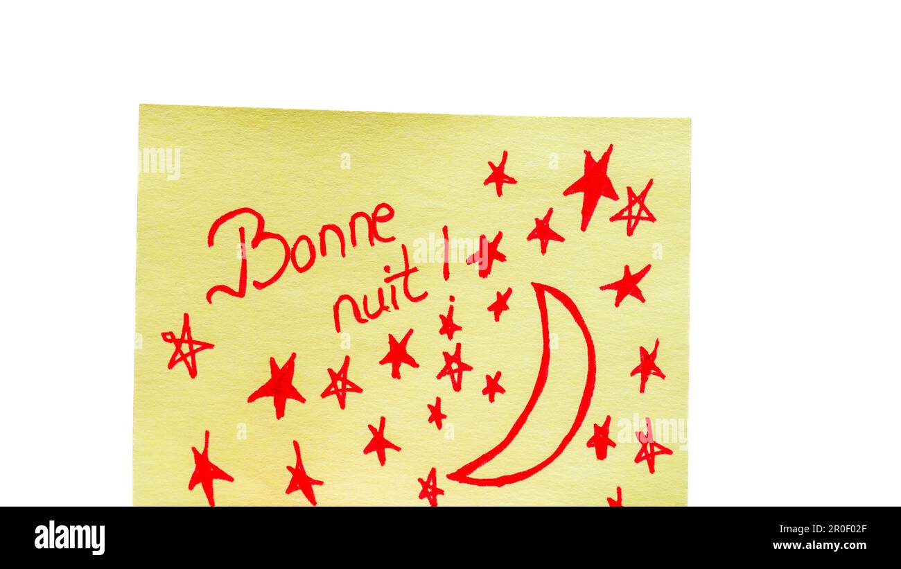 Bonne nuit (good night) handwriting text close up isolated on yellow ...