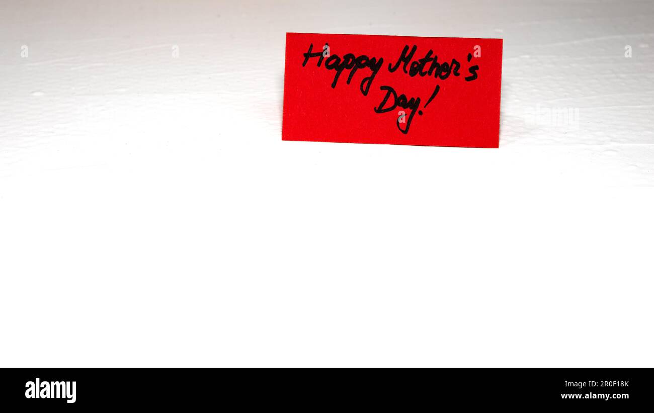 Happy mother`s day writing love text for mother on paper. Label tag ...