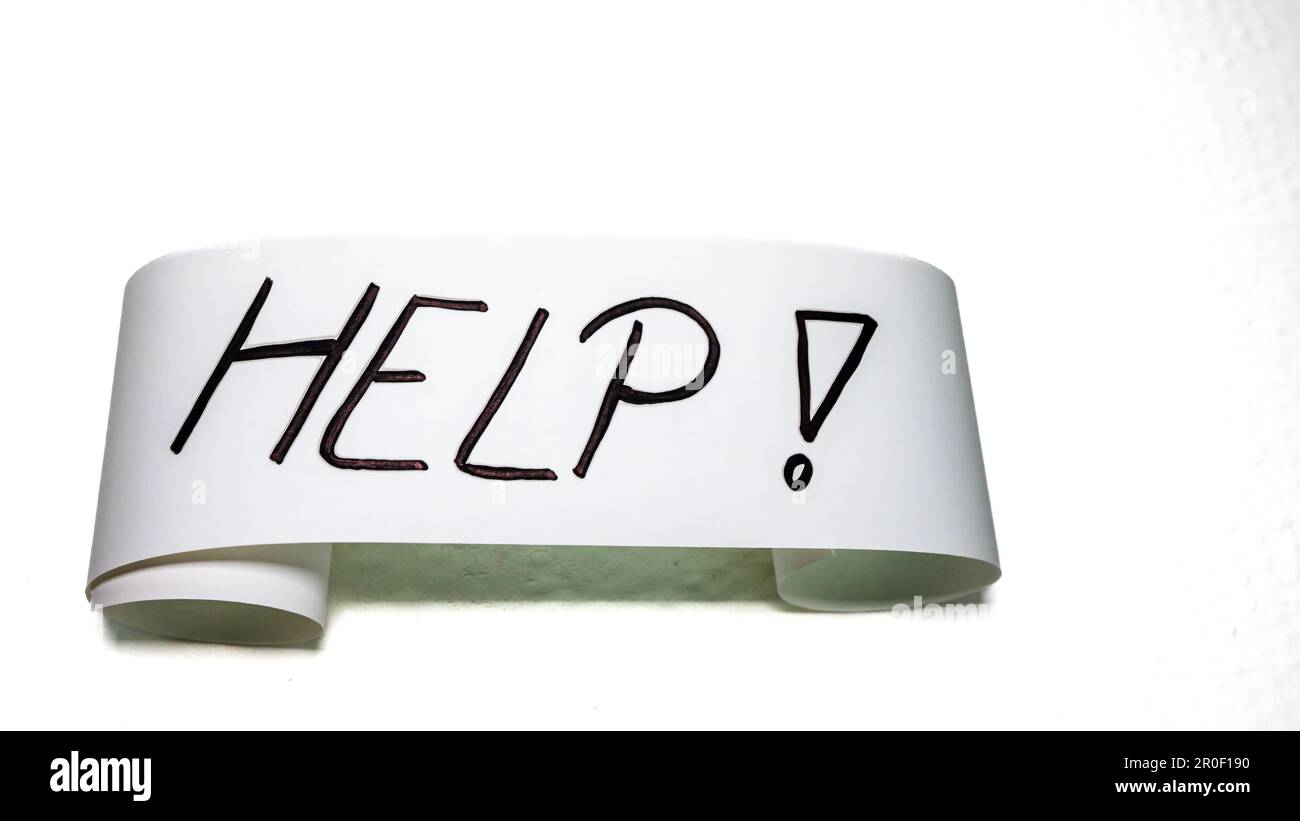 Writing help on white label on white background Stock Photo - Alamy