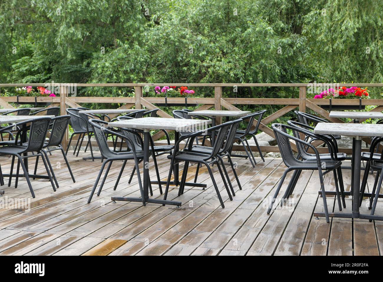 outdoor furniture for outdoor dining on a rainy day Stock Photo - Alamy