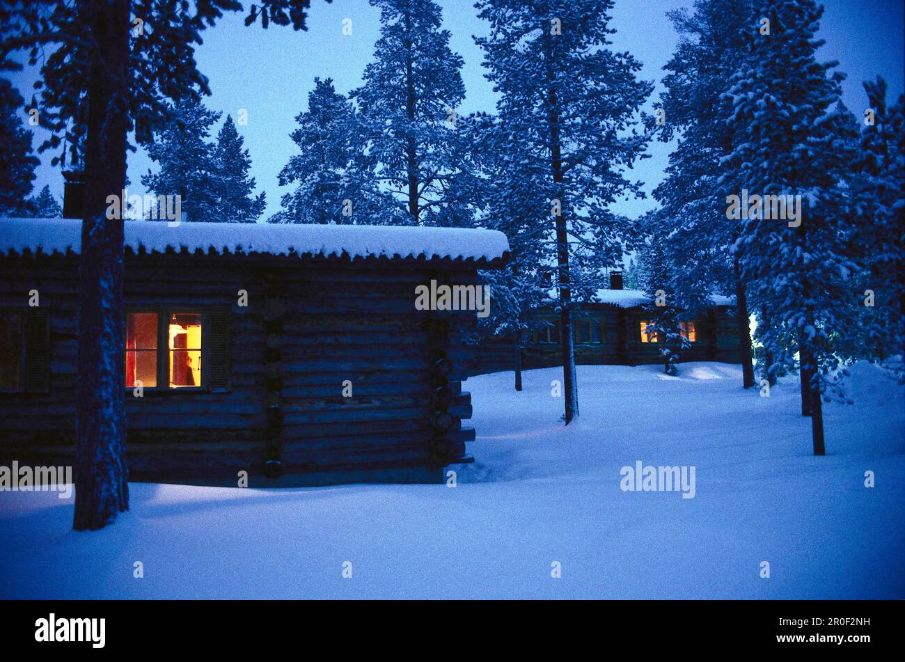 Log cabins in the snow in the evening, Lapland, Finland, Europe Stock ...