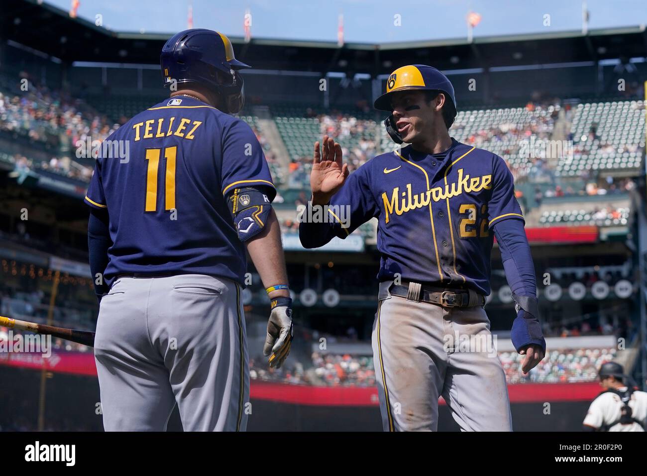 Milwaukee Brewers' Rowdy Tellez (11) and Christian Yelich (22) during a ...