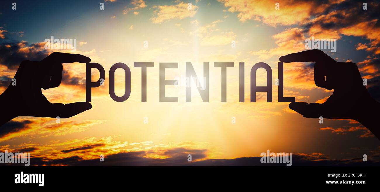 Potential - human hands holding black silhouette word Stock Photo - Alamy