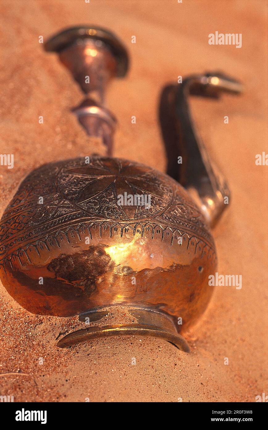 Copper jug in the sand of the desert, Dubai, V.A.E., United Arab ...