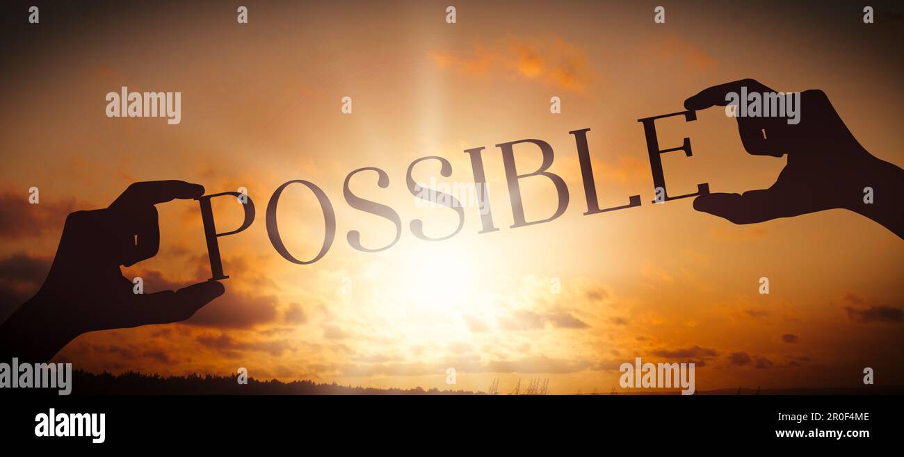 Possible - human hands holding black silhouette word Stock Photo - Alamy