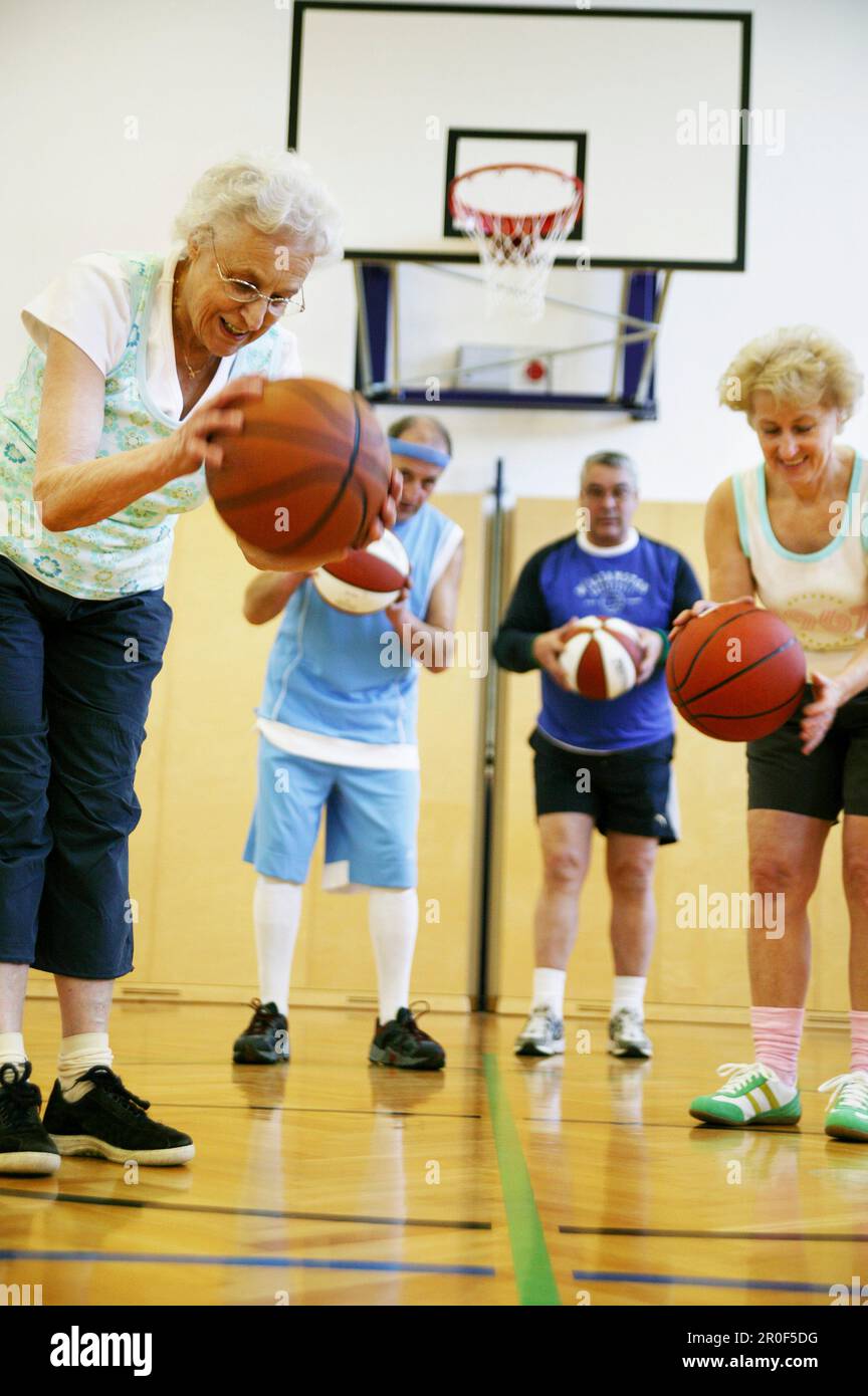Mature People playing basketball Stock Photo - Alamy