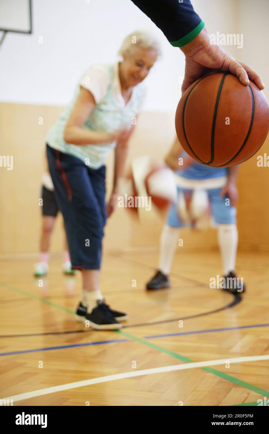 Mature People playing basketball Stock Photo - Alamy