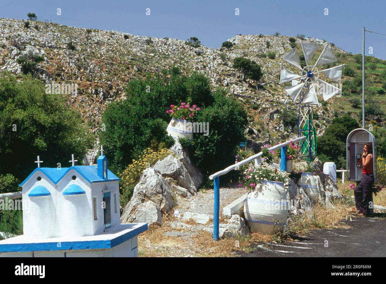 Woman in telephone box, Zenia, Crete, Greece Stock Photo - Alamy