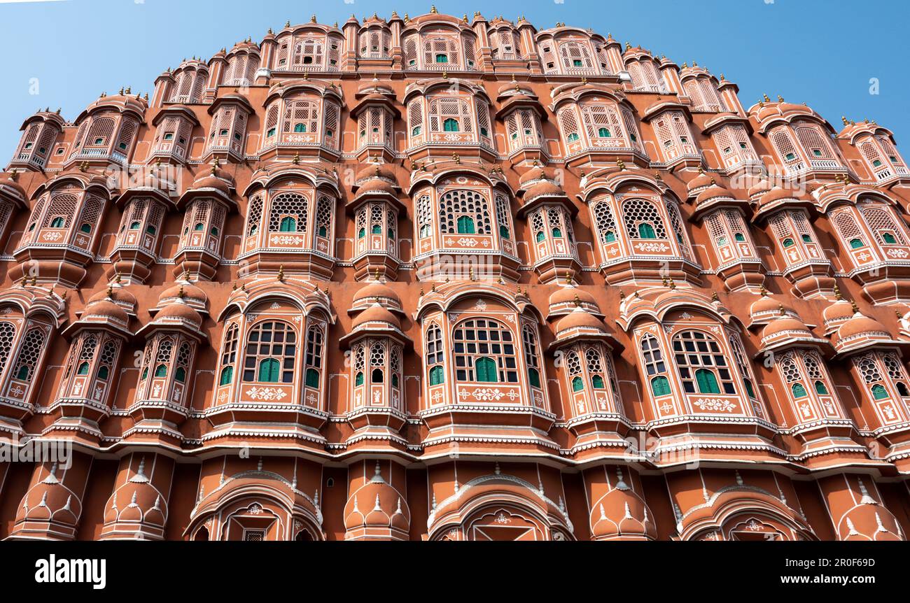 A low-angle shot of the iconic Hawa Mahal in Jaipur, India, featuring detailed and impressive ...