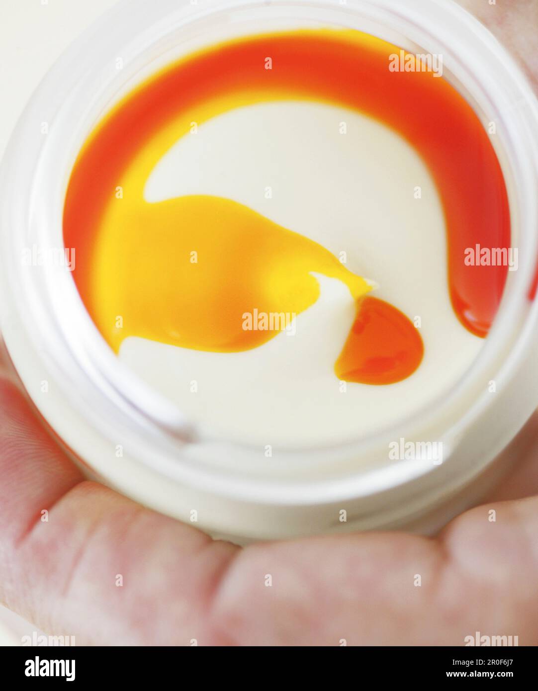 Hand holding Moisturizer Stock Photo - Alamy