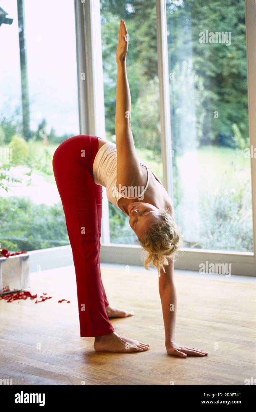 Woman in sportswear bending legs hi-res stock photography and images ...