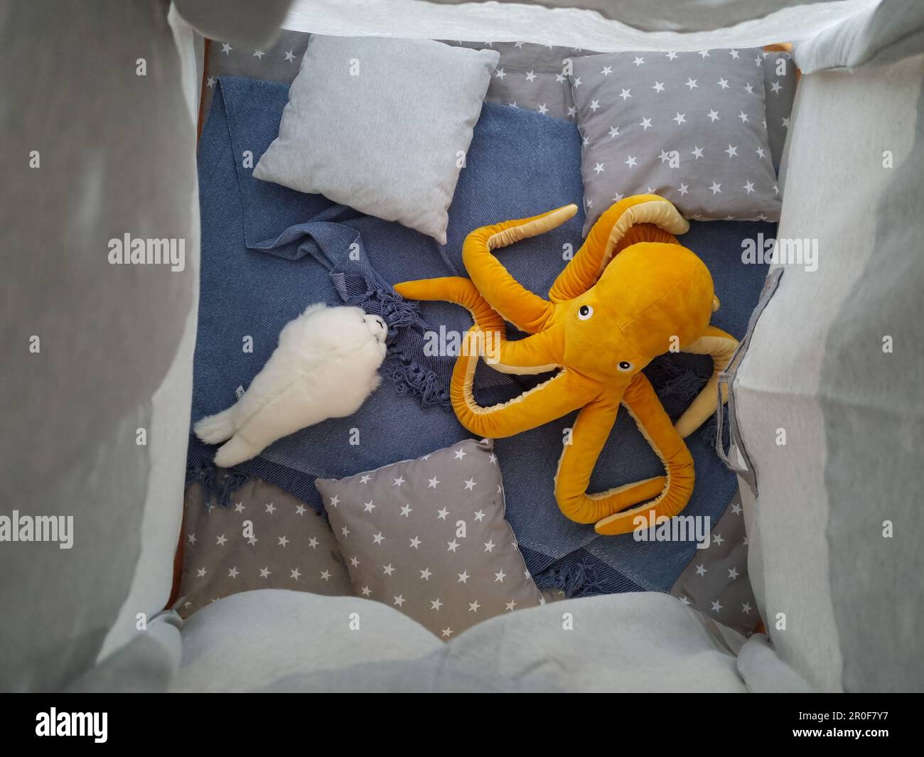 Interior of a kids' teepee. Playing tent with pillows and toys ...