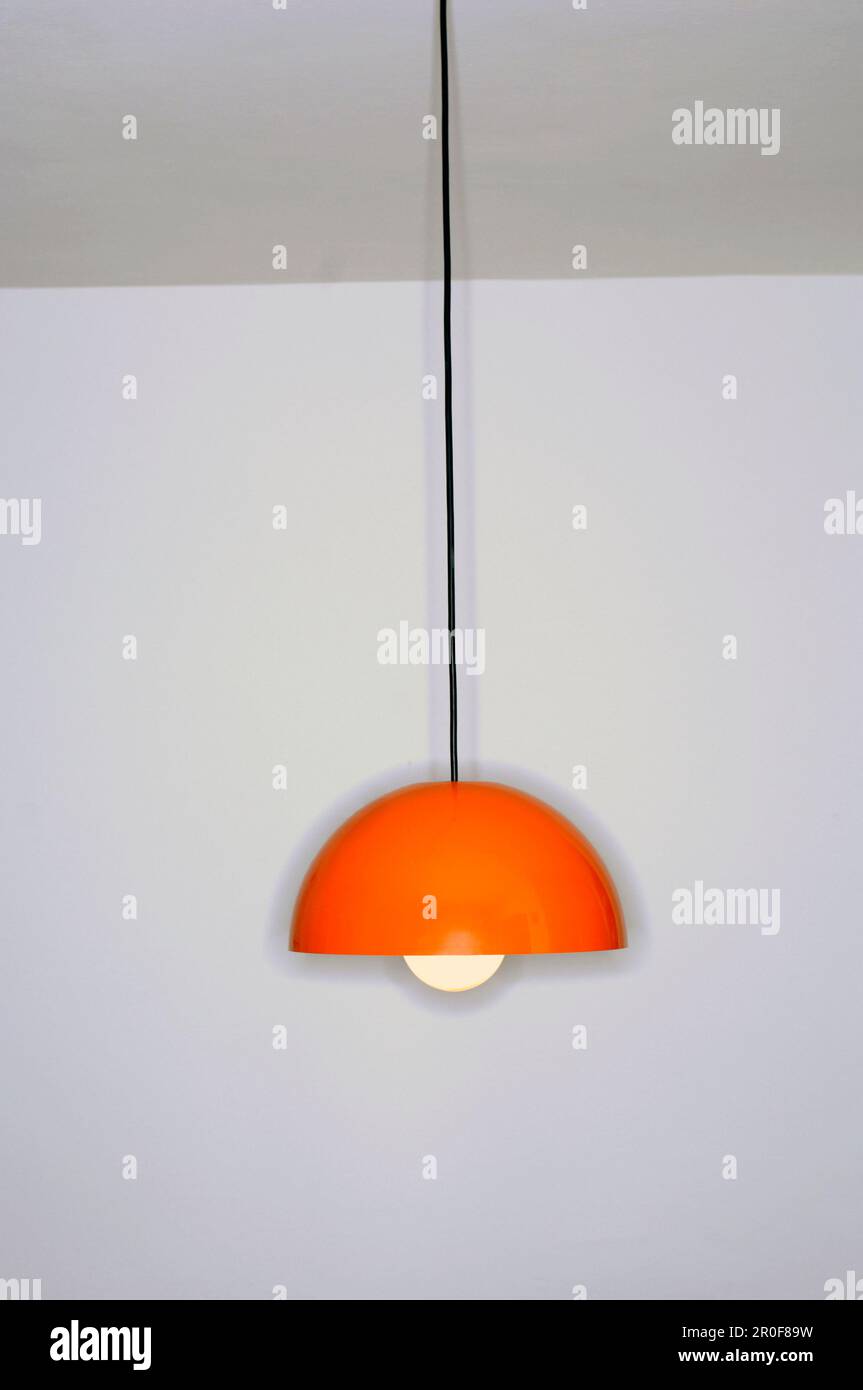 Orange 1970s style ceiling light in empty livingroom Stock Photo - Alamy