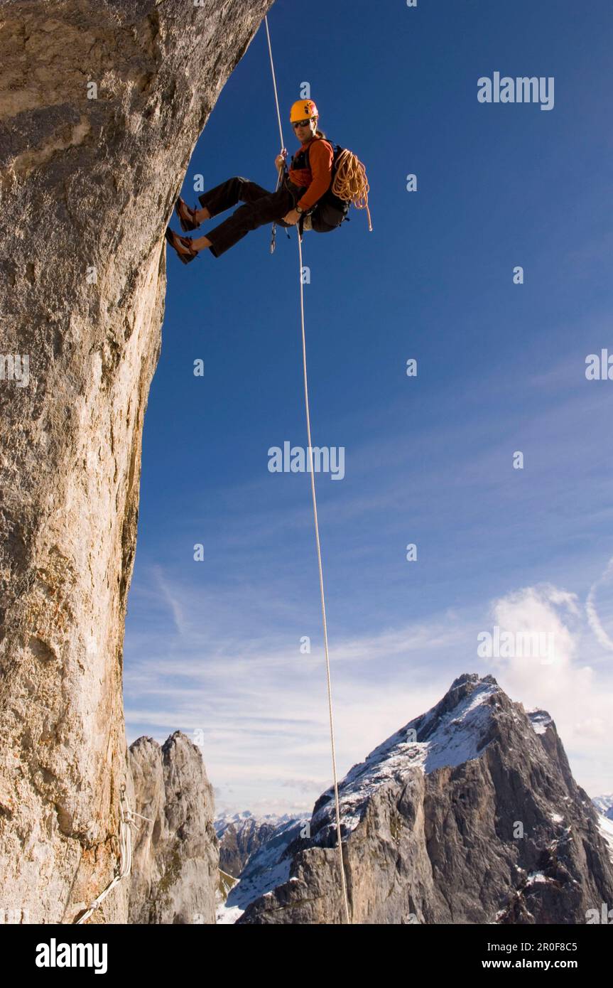 Climber abseiling from Raetikon Mountain, Switzerland Stock Photo - Alamy