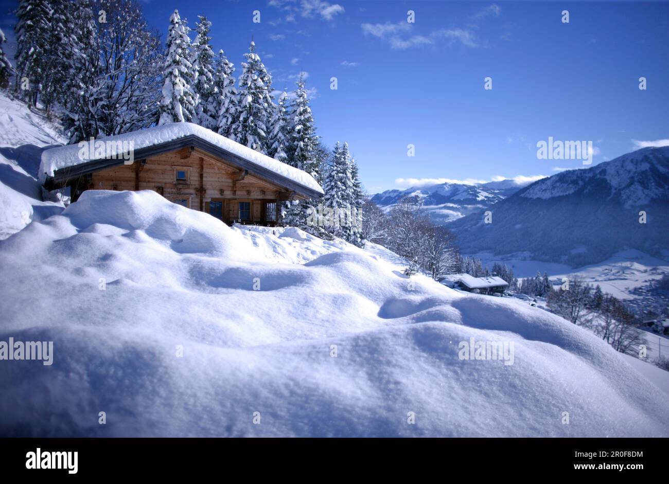 Snow covered log cabin, holiday ski lodge, Nieding, Brixen im Thale ...