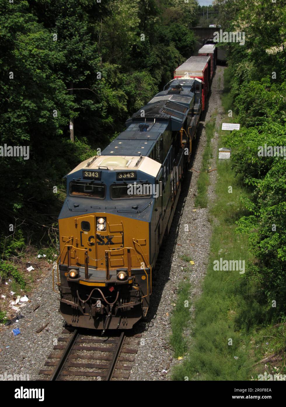 A CSX freight train carries cargo south along a rail line in the city's ...