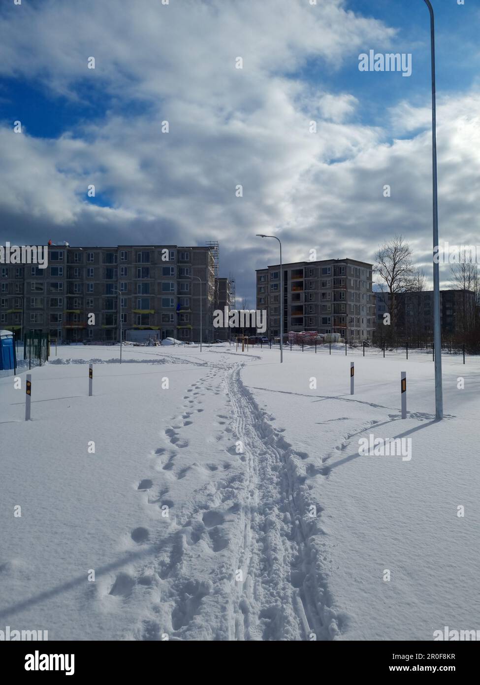 Modern apartment complex in a construction process. Multi-storey ...