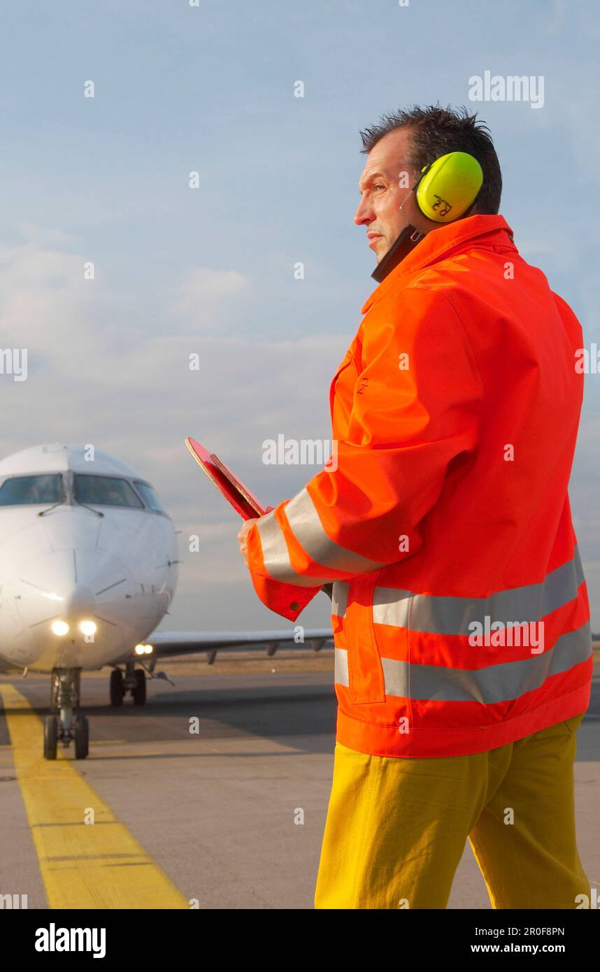 Rear view airport ground crew hi-res stock photography and images - Alamy