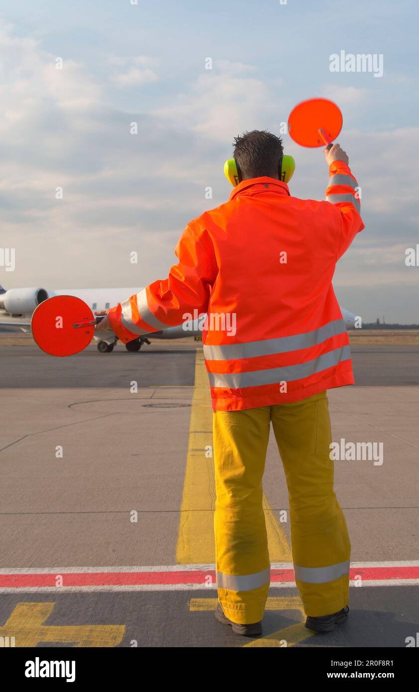 Rear view airport ground crew hi-res stock photography and images - Alamy