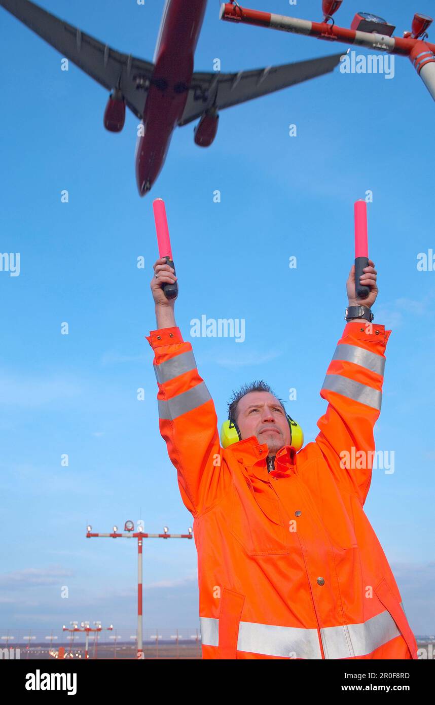 Man with signaling sticks hi-res stock photography and images - Alamy