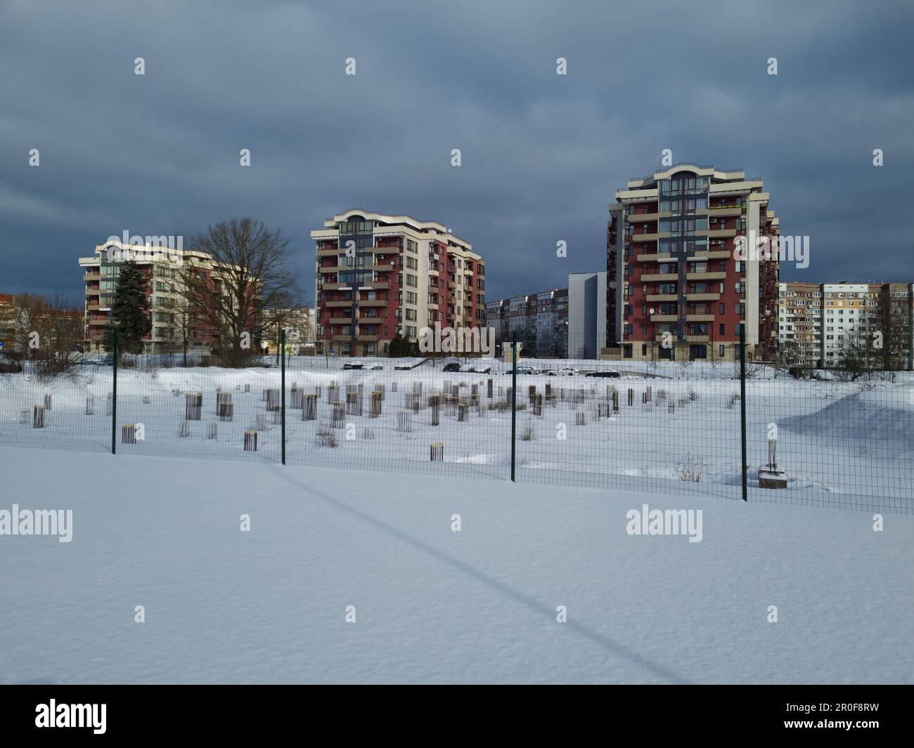 Multi-storey residential houses stand in line. Living apartment complex ...