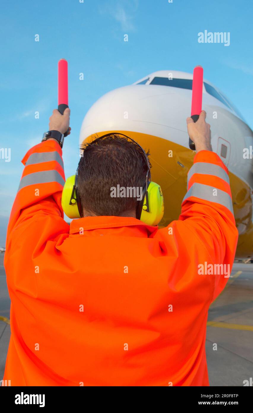Rear view airport ground crew hi-res stock photography and images - Alamy
