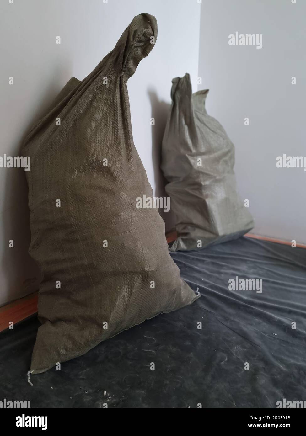 Garbage and waste from dismantling in bags for disposal. One of the ...