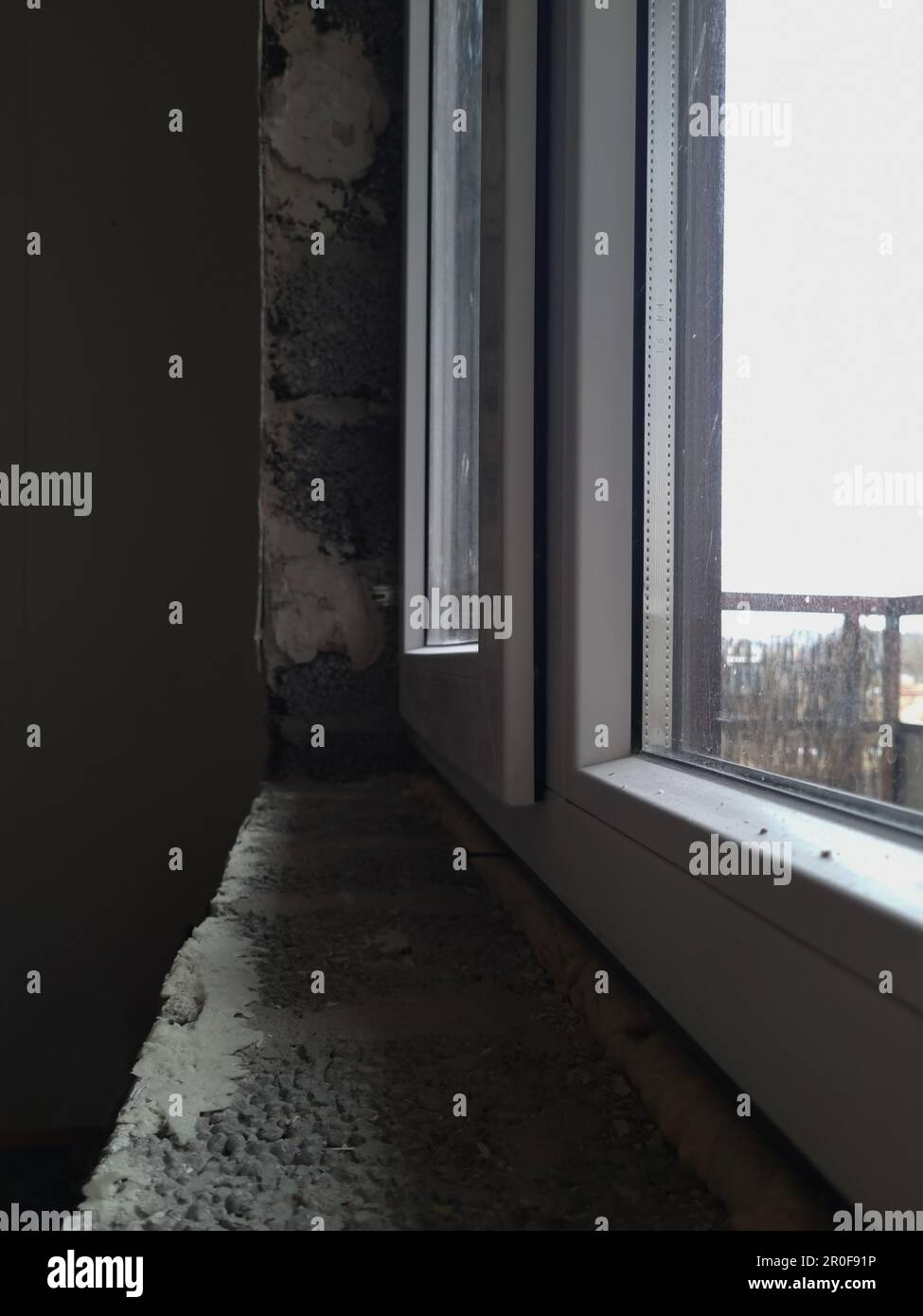 Old mounting foam between a pvc window and a brick wall. Dismantling of ...