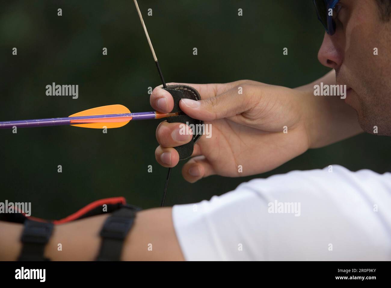 Archer taking aim at target Stock Photo - Alamy
