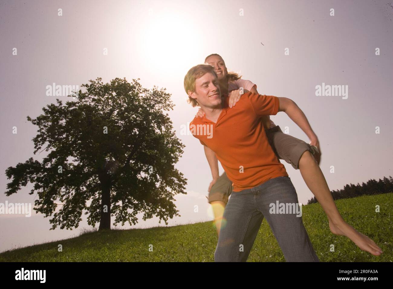 Old man giving woman piggyback hi-res stock photography and images - Alamy