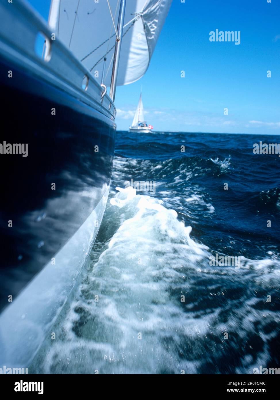 Sailboat cutting through water, Bay of Kiel between Germany and Denmark ...
