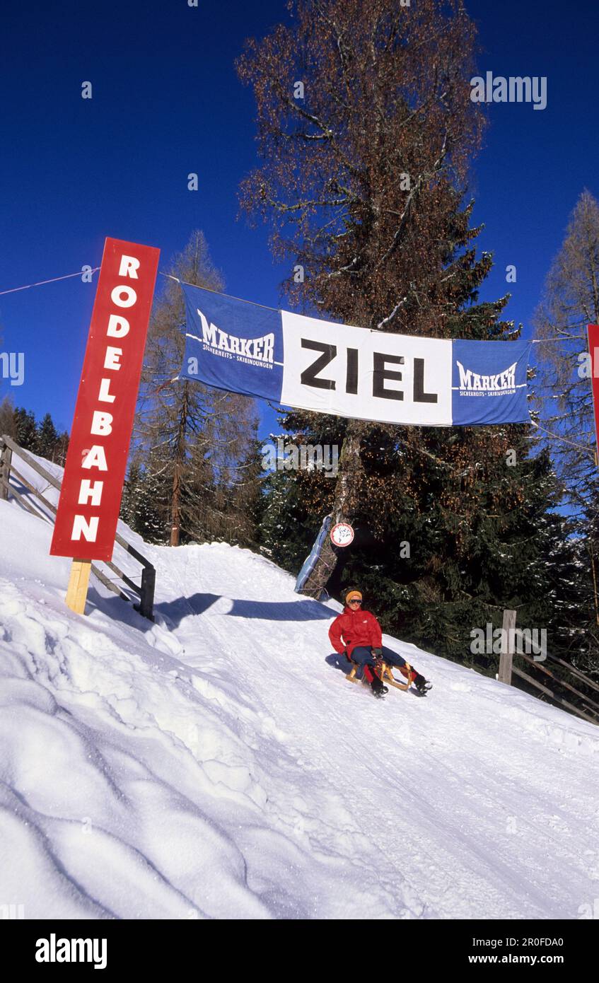 Sledging on the toboggan-run, reaching winning post, Kleinbergalm ...