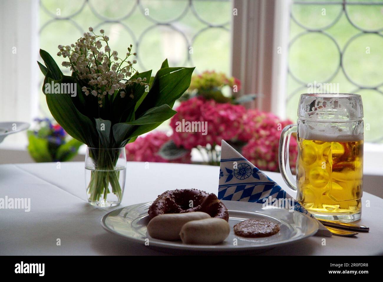 Weisswurst served with sweet mustard and accompanied be Brezen and Beer ...