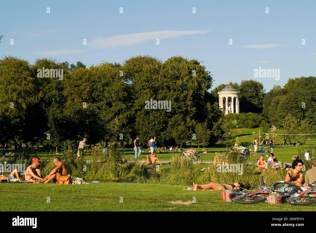 Sunbathing at Eisbach in front of Monopteros, English Garden, Munich ...