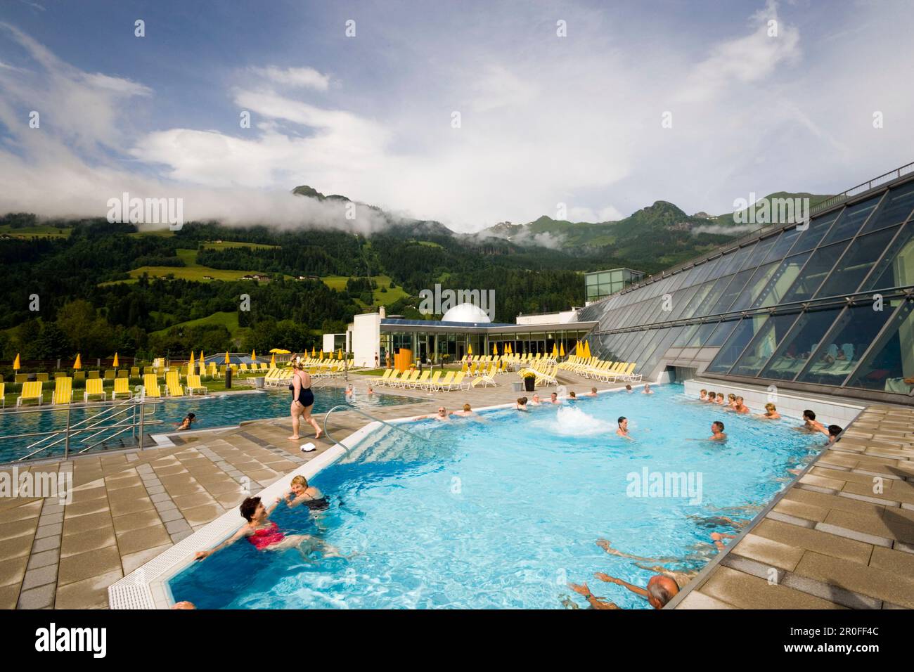 People bathing in a thermal outdoor pool, Alpen Therme Gastein, Bad Hofgastein, Gastein Valley ...