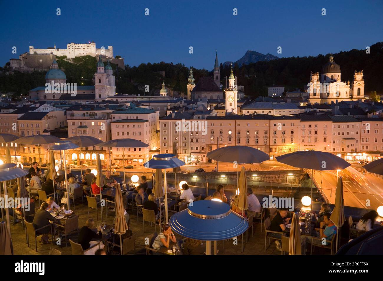 View over the illuminated roof terrace of restaurant Hotel Stein in the ...