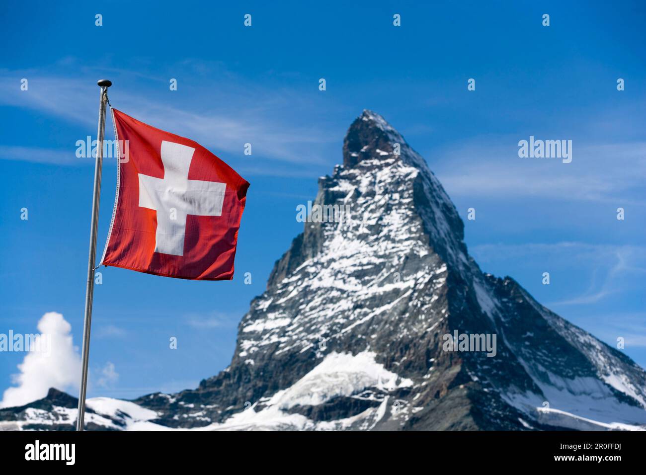 Swiss flag in front of the Matterhorn 4478 meters, Zermatt, Valais ...