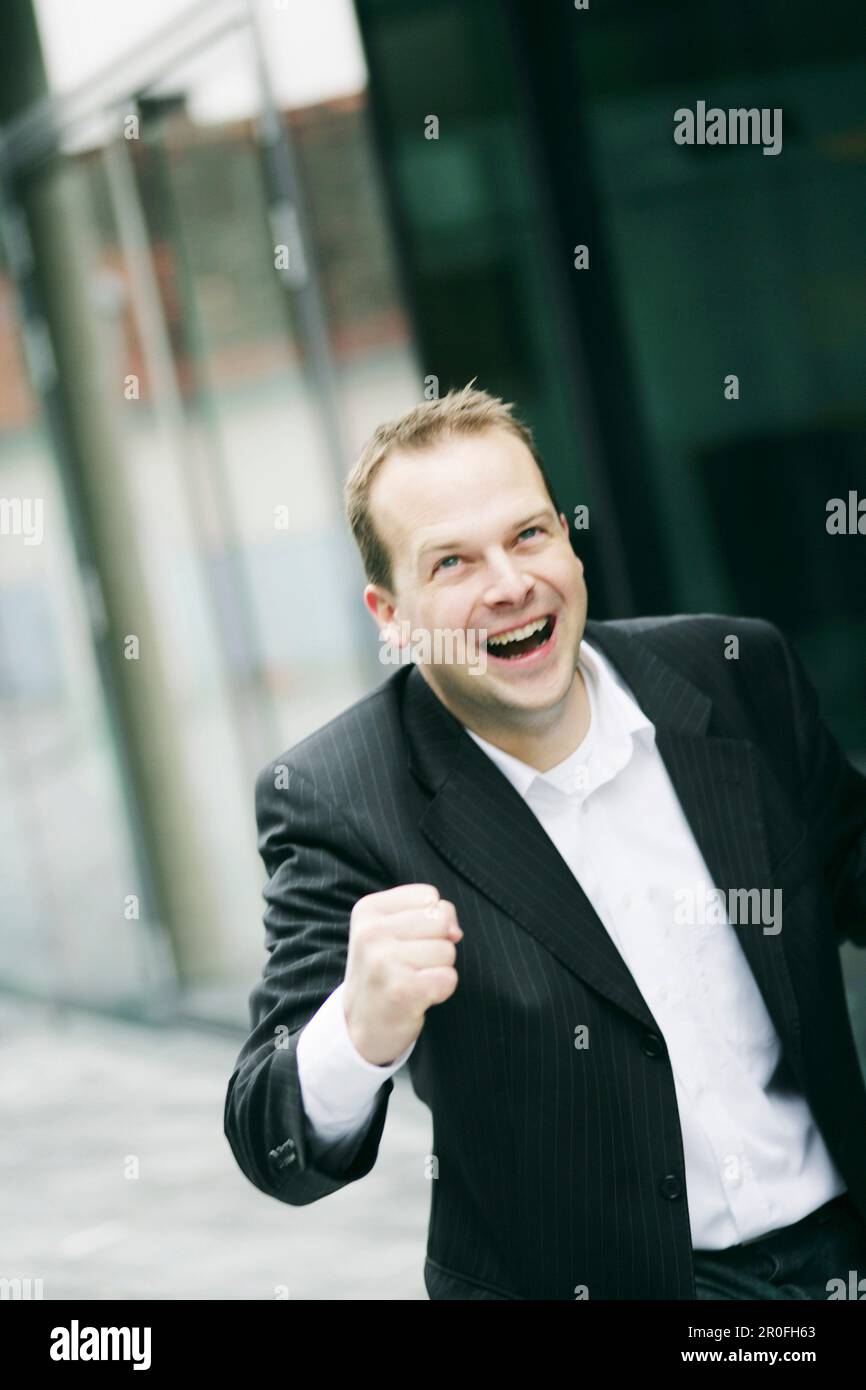 Happy businessman cheering outside hi-res stock photography and images ...