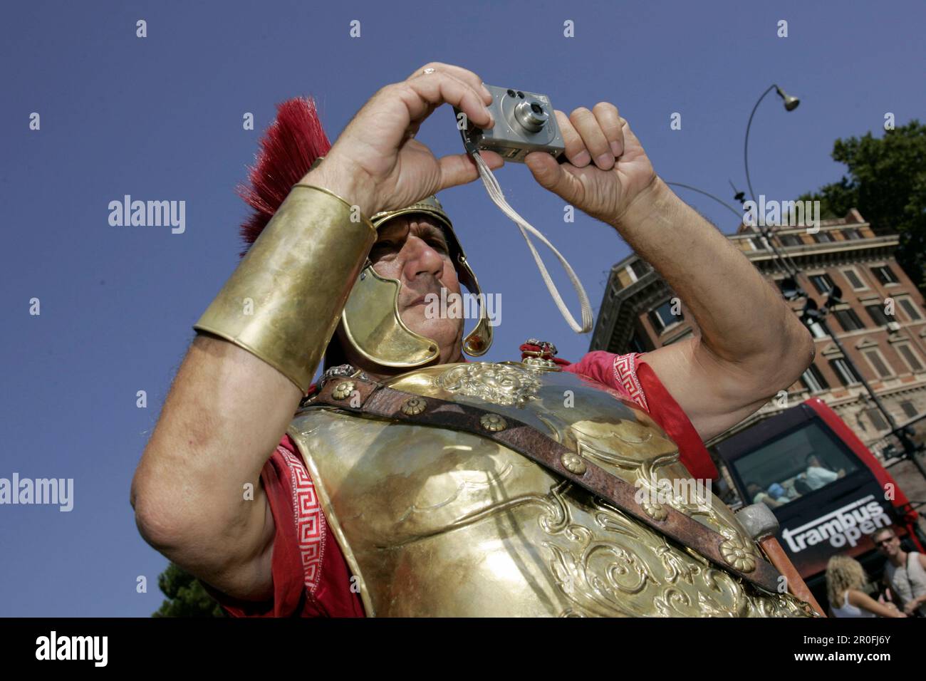 Man in Roman costume taking a photograph for tourist cameras near ...