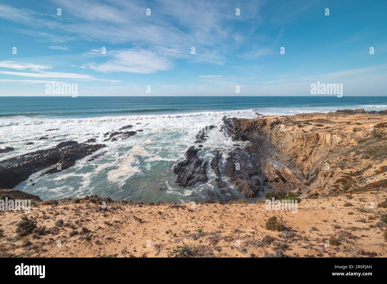 View of the rocky outcrops rising from the Atlantic Ocean in Odemira ...
