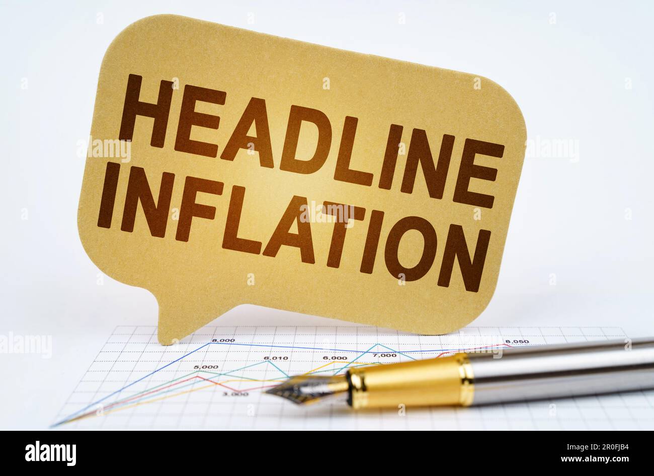 Business concept. On the business diagram is a pen and a sign with the ...