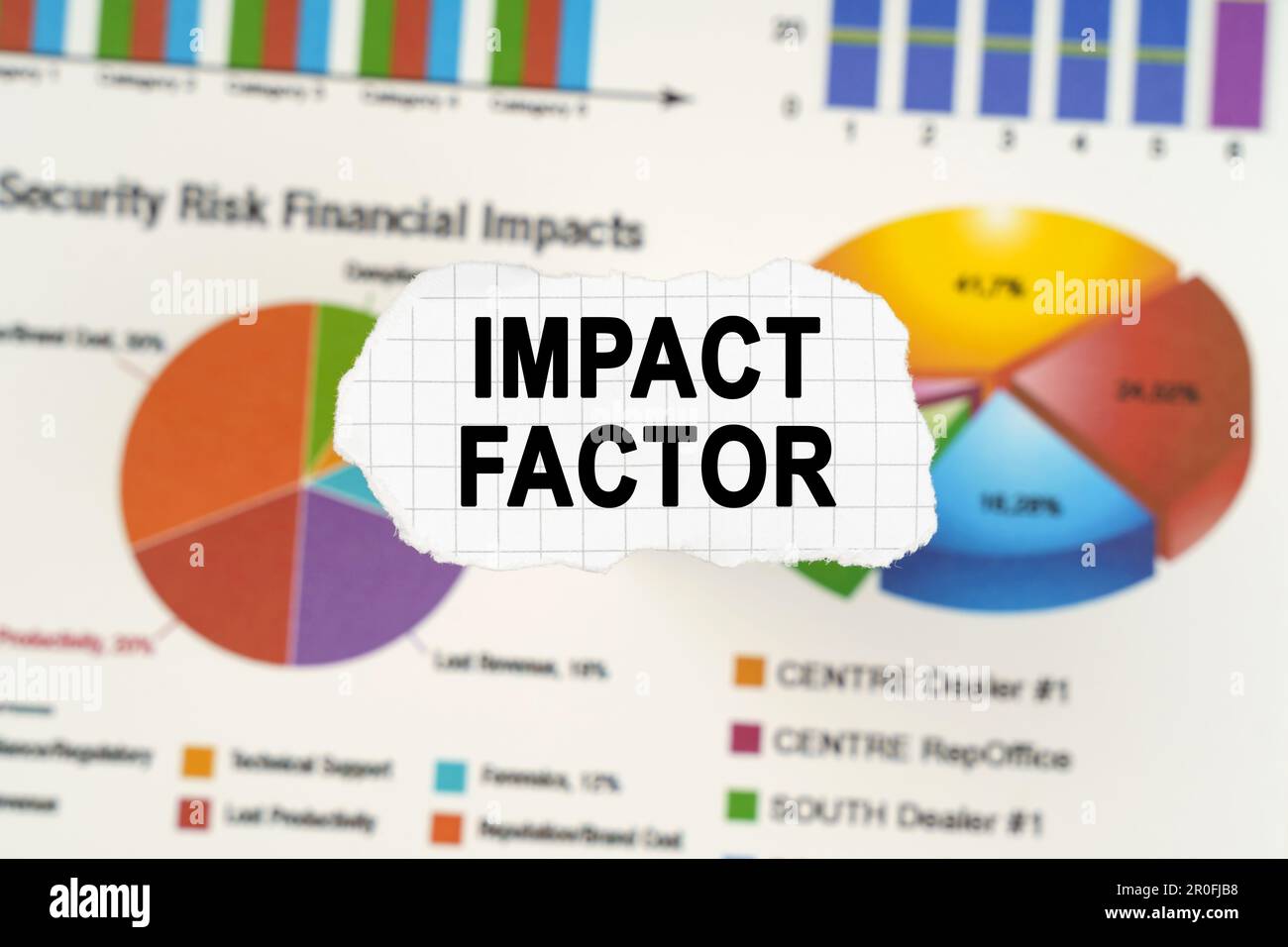 Business concept. On diagrams and graphs lies torn paper with the ...