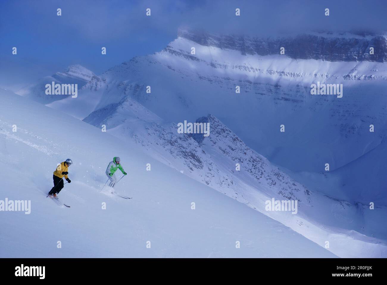 Two skiers in deep snow, Lake Louise, Alberta, Canada Stock Photo - Alamy