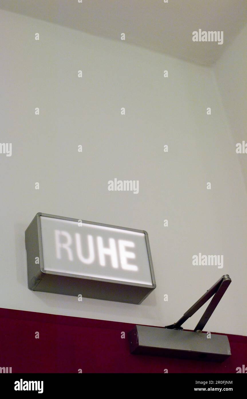 Illuminated quiet sign above a door Stock Photo - Alamy