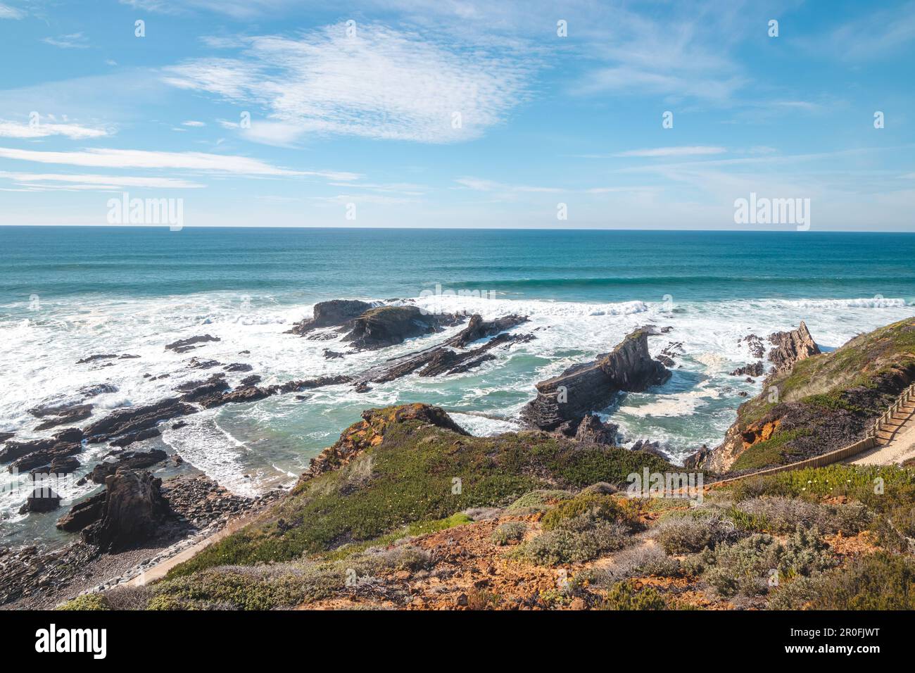 View of the rocky outcrops rising from the Atlantic Ocean in Odemira ...