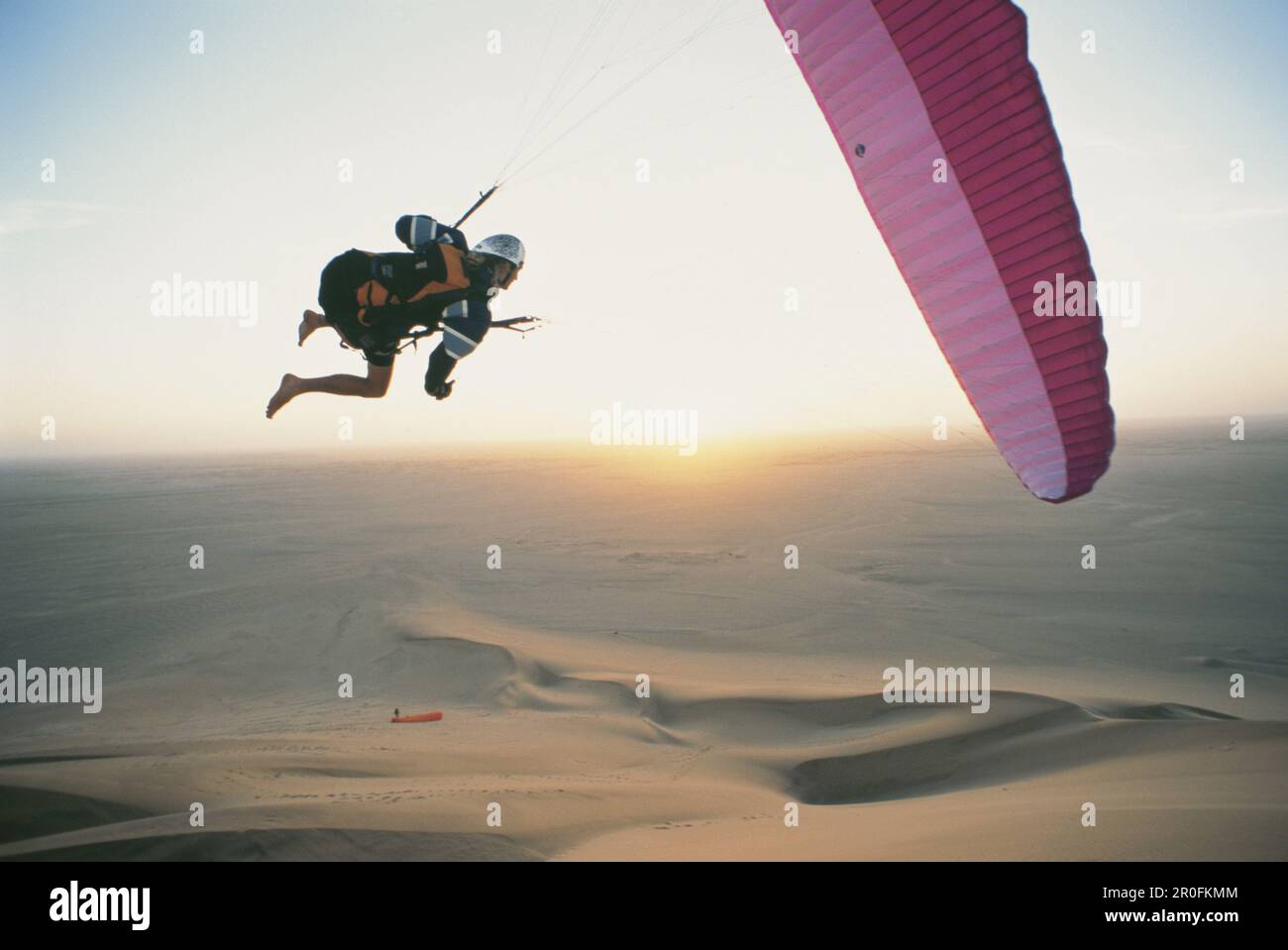 Paraglider over desert, Walfish Bay, Namibia Stock Photo - Alamy
