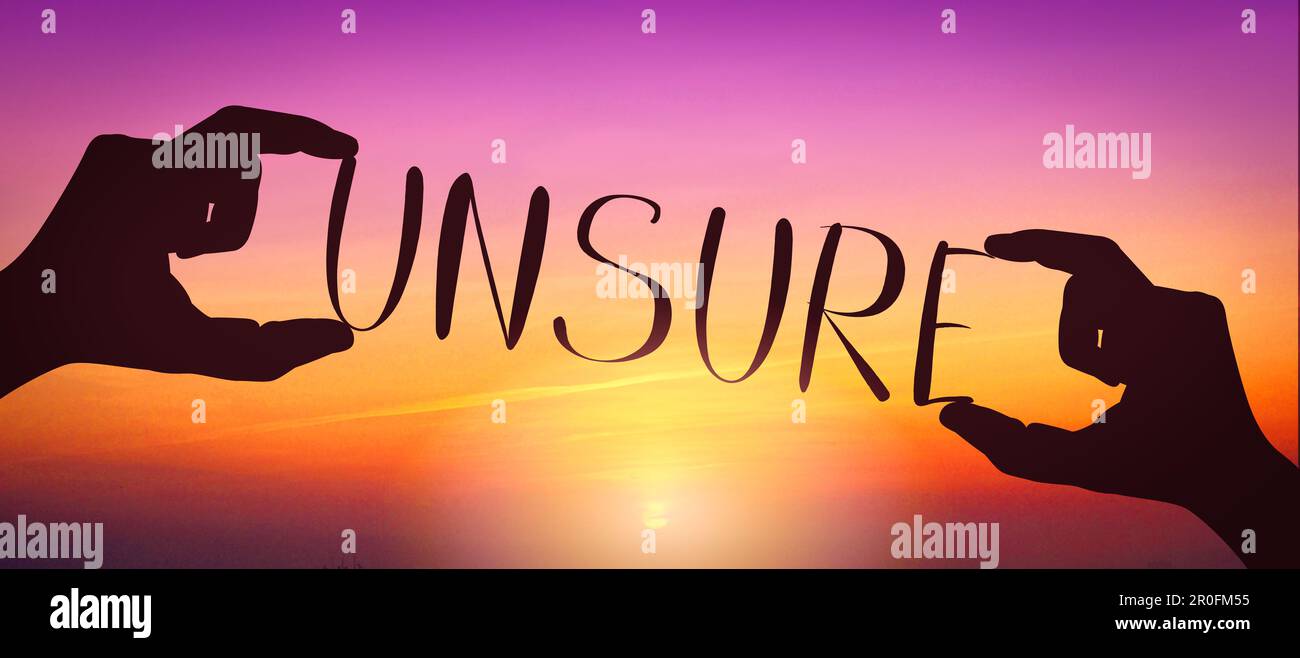 Unsure - human hands holding black silhouette word Stock Photo - Alamy