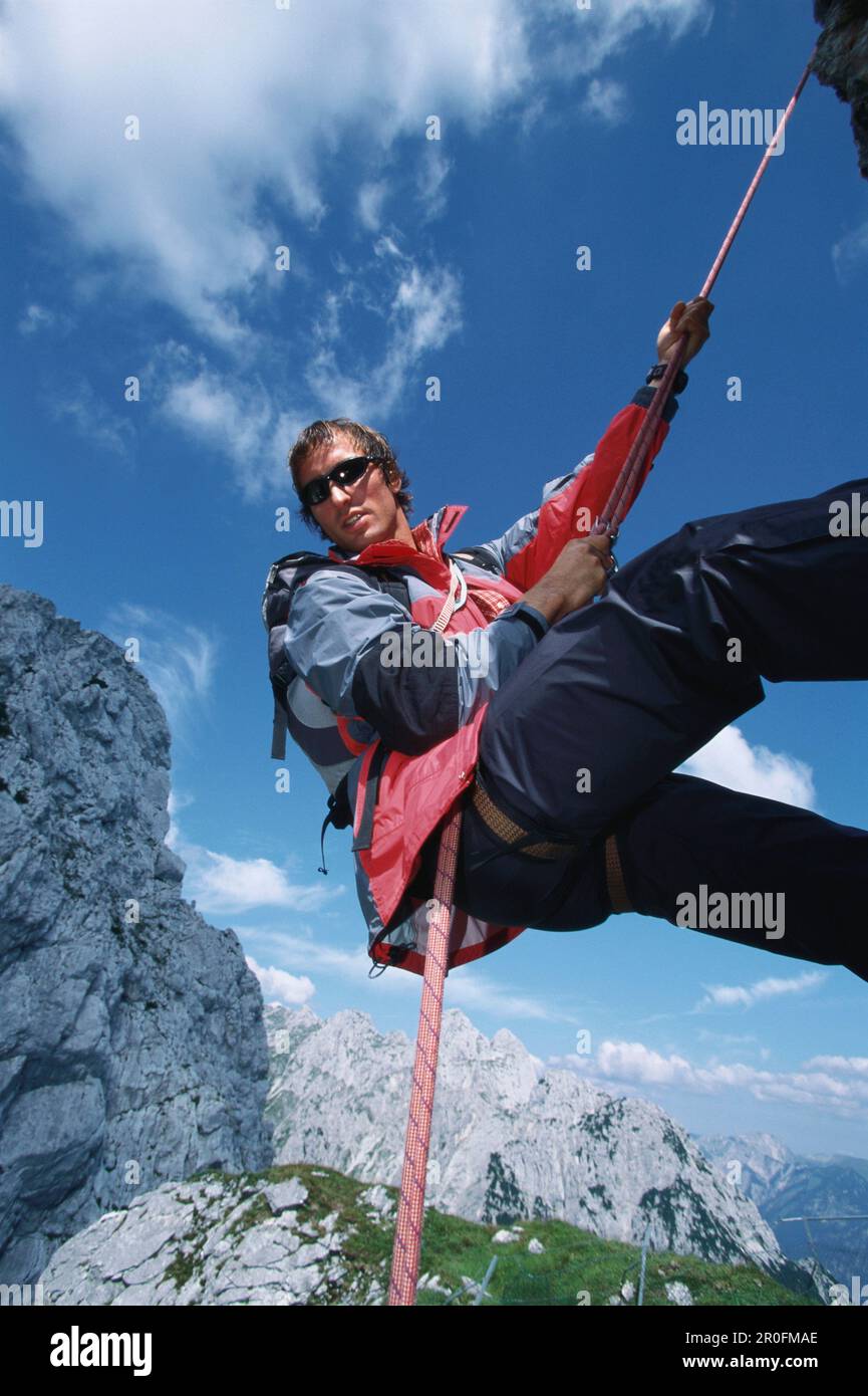 Climber rappeling down from mount Alpspitze, Garmisch-Partenkirchen ...